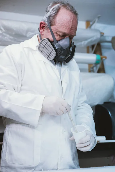 59 year old man working at the fiber workshop Stock Photo by ...