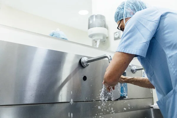 Doctors washing hands — Stock Photo © SimpleFoto #6543312