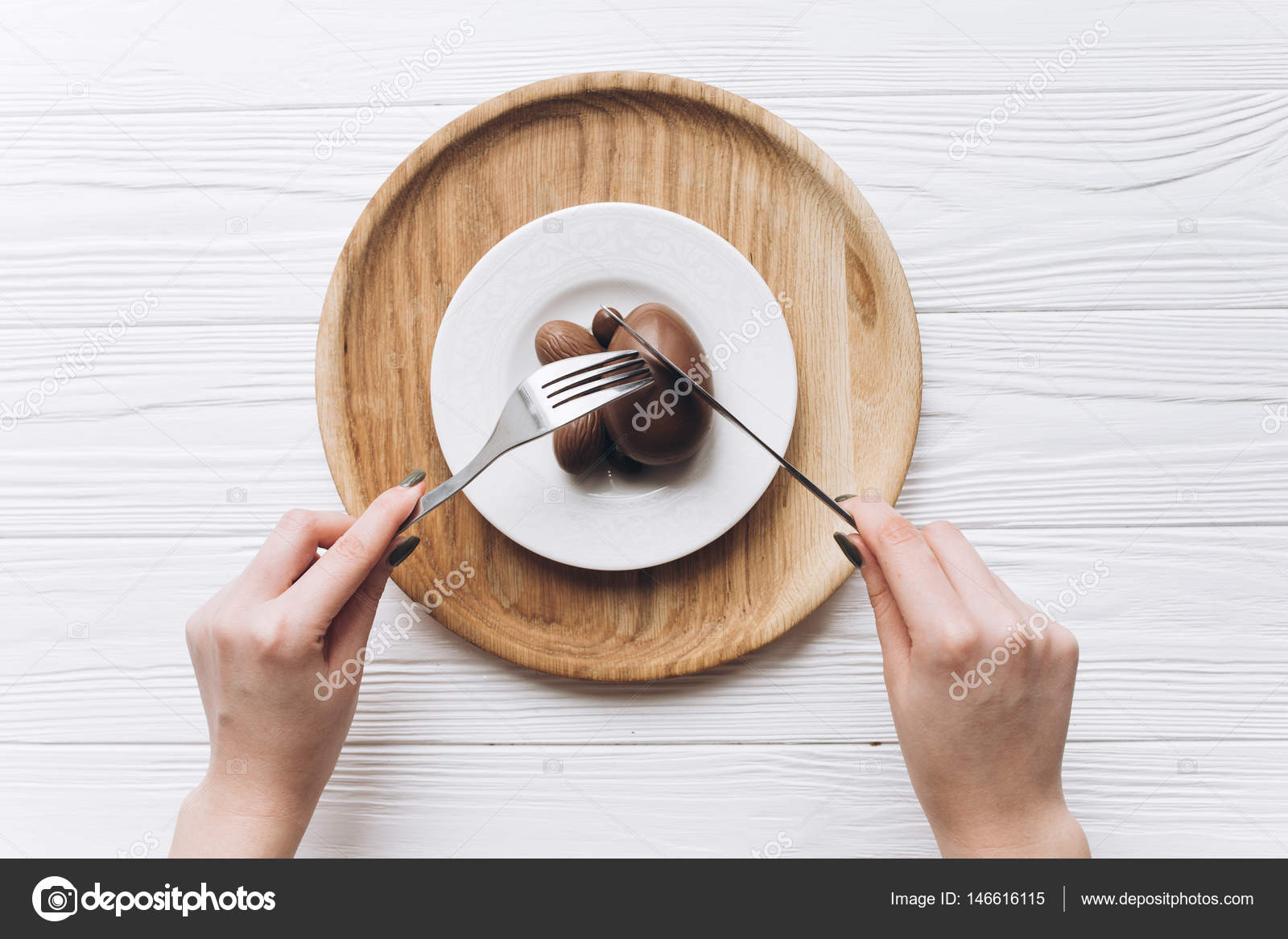 Eating Easter chocolate eggs Stock Photo by ©anatoliycherkas 146616115