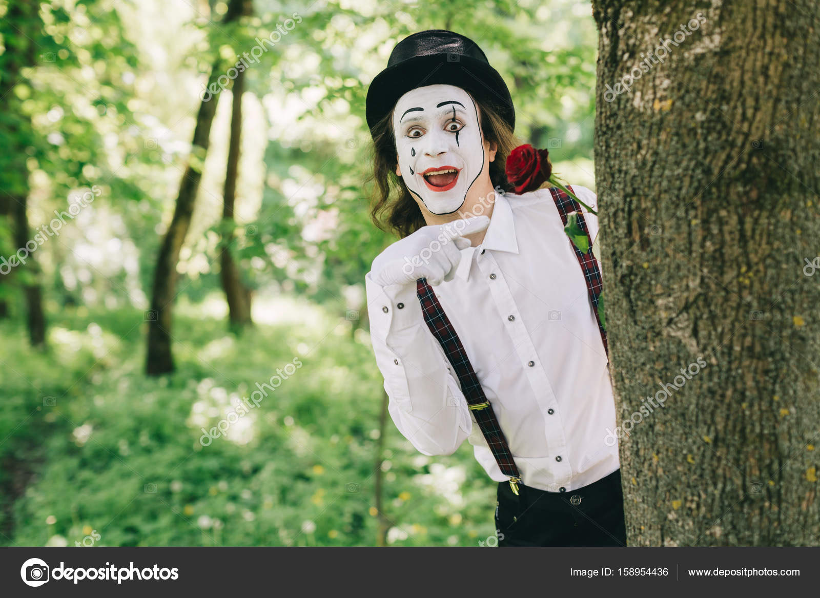 Mime artist with red rose — Stock Photo © anatoliycherkas #158954436