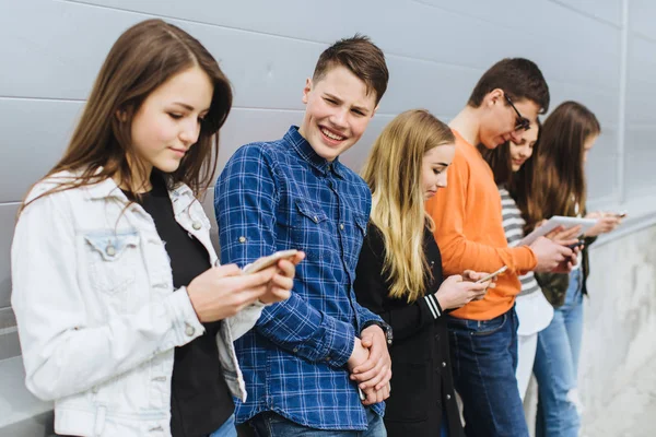 Group of teenagers outdoors with mobile phones Stock Photo by ...