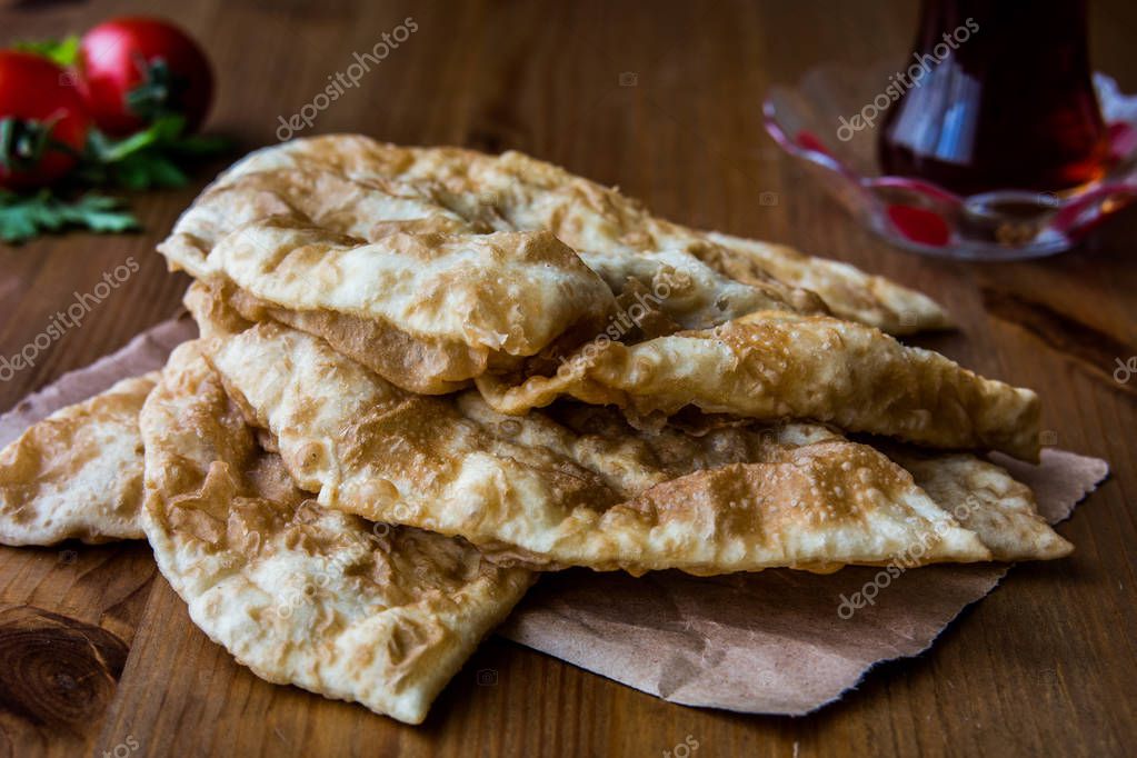Turkish Cig Borek / Tatar Pie with minced meat and tea Stock Photo by ...