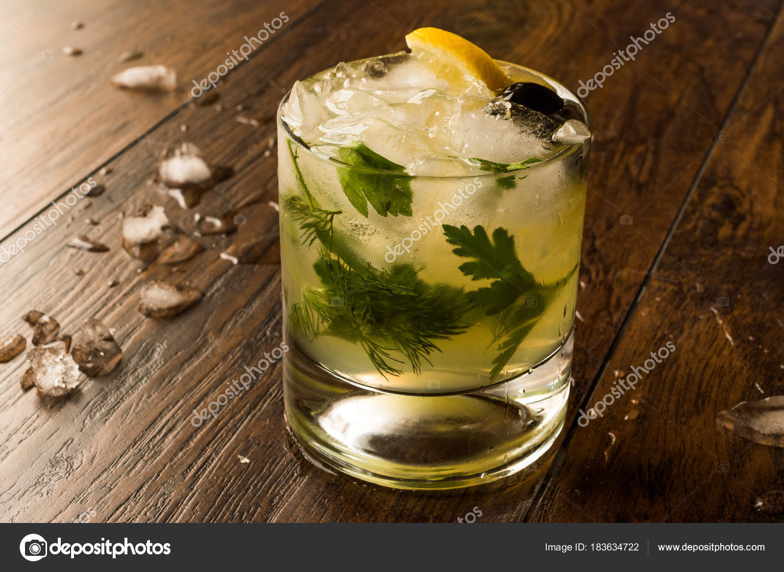 Dillionaire Cocktail with Dill, Gin, Parsley, lemon, Olive and Crushed ...