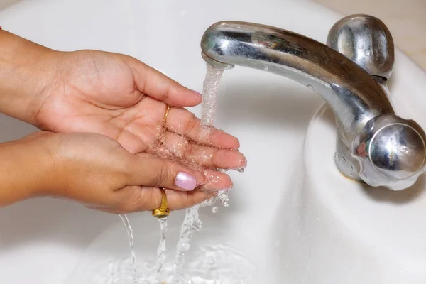 Woman washing hands for hygiene as Corona virus prevention awareness ...