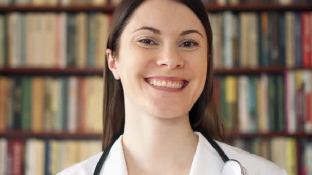Female medical student in library ready for final exams preparation ...