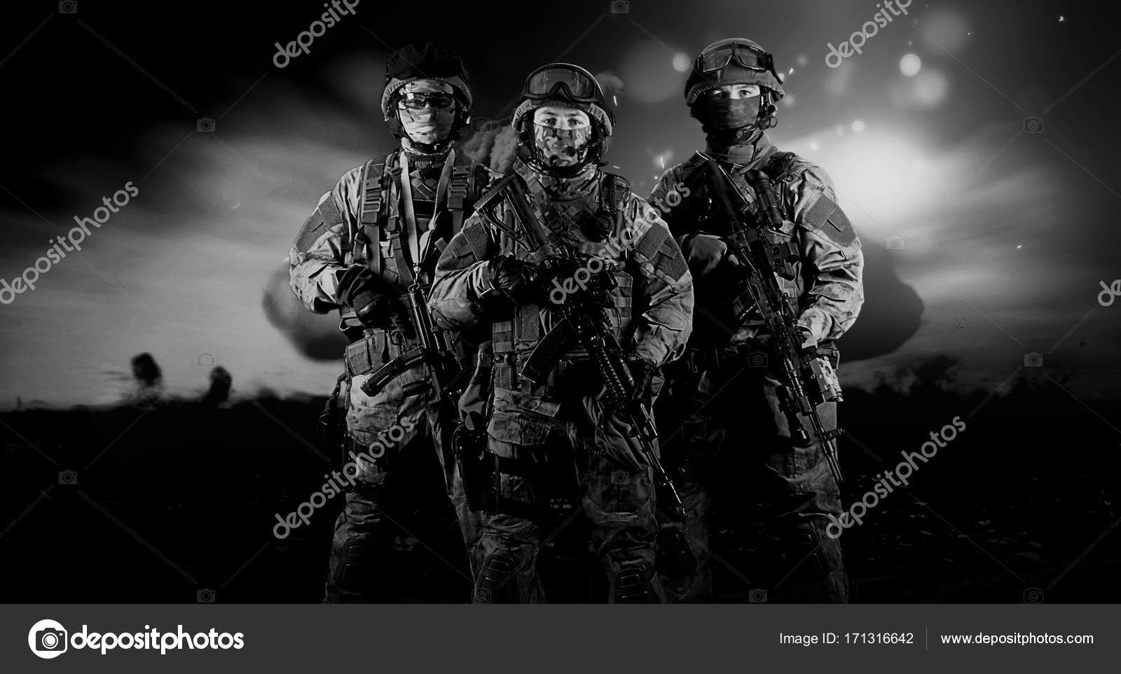 Three soldiers in uniform with a weapon in their hands are looki Stock ...