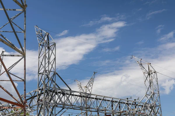 Close view of telecom tower and electric power structure against a ...