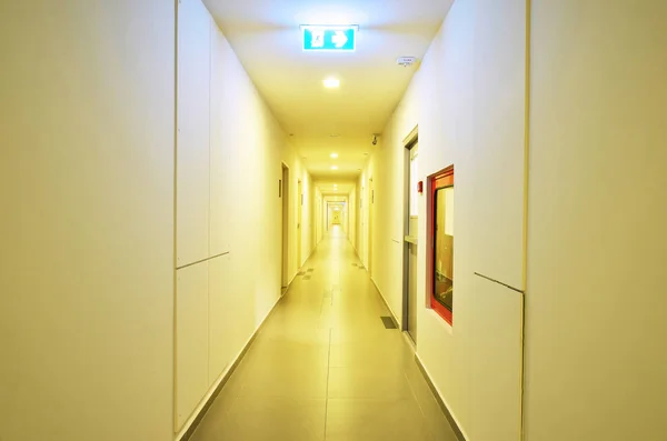Walkway Exit fire escape door with signs. Stock Photo by ©phochi 154054090