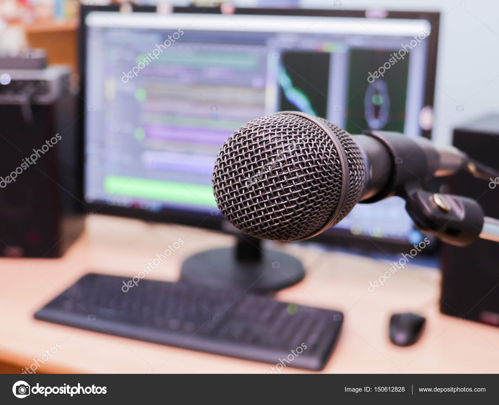 Microphone on the background of the computer monitor. Home recording ...