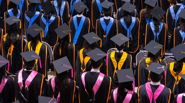 Soft selective focus rear view of the graduates in the graduation ...