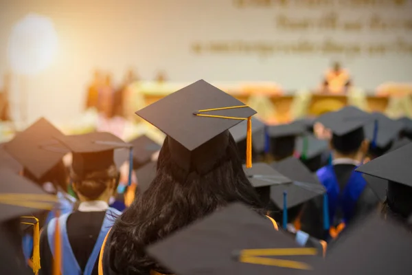 Soft selective focus rear view of the graduates in the graduation ...