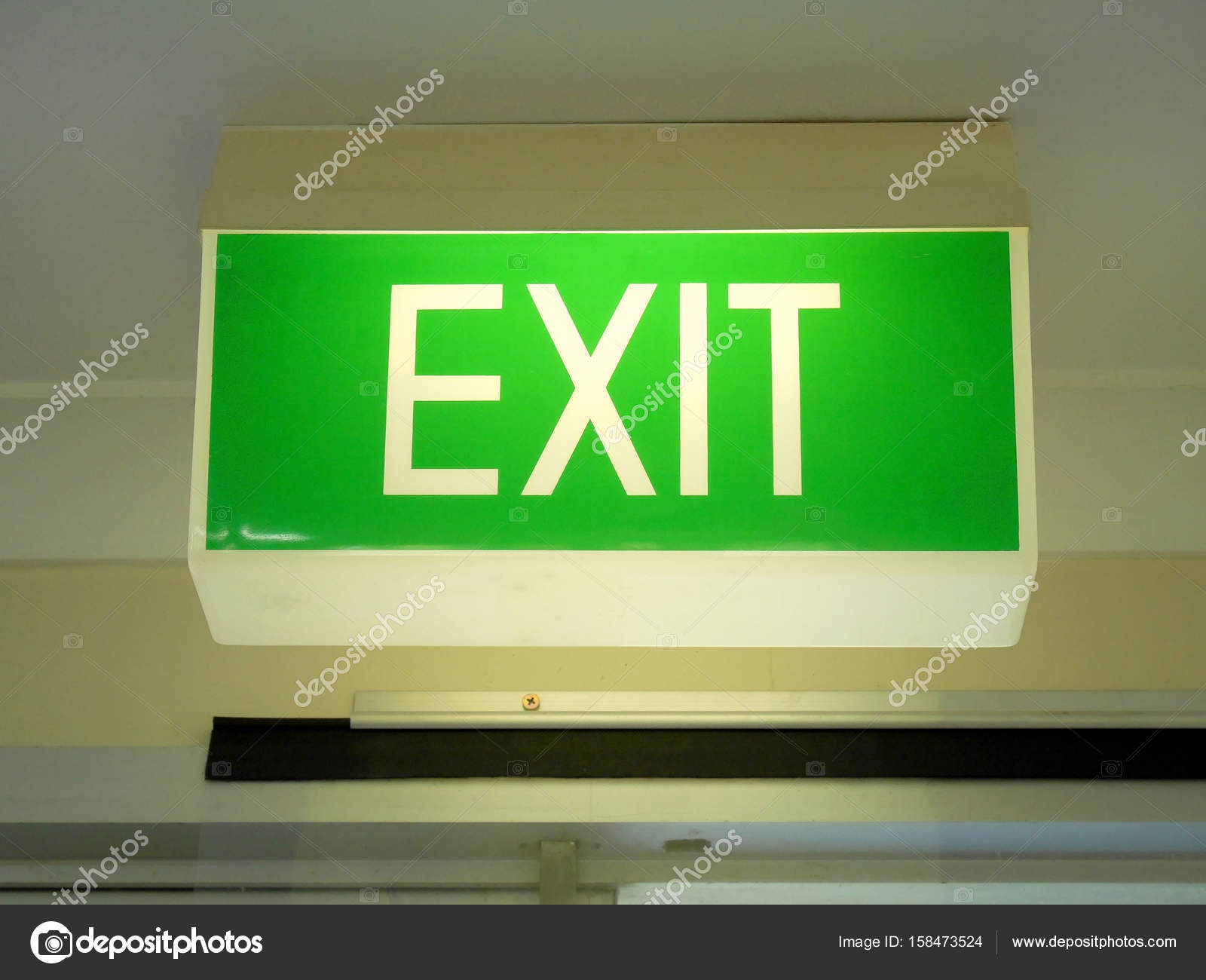 Green exit sign Stock Photo by ©p_saranya 158473524