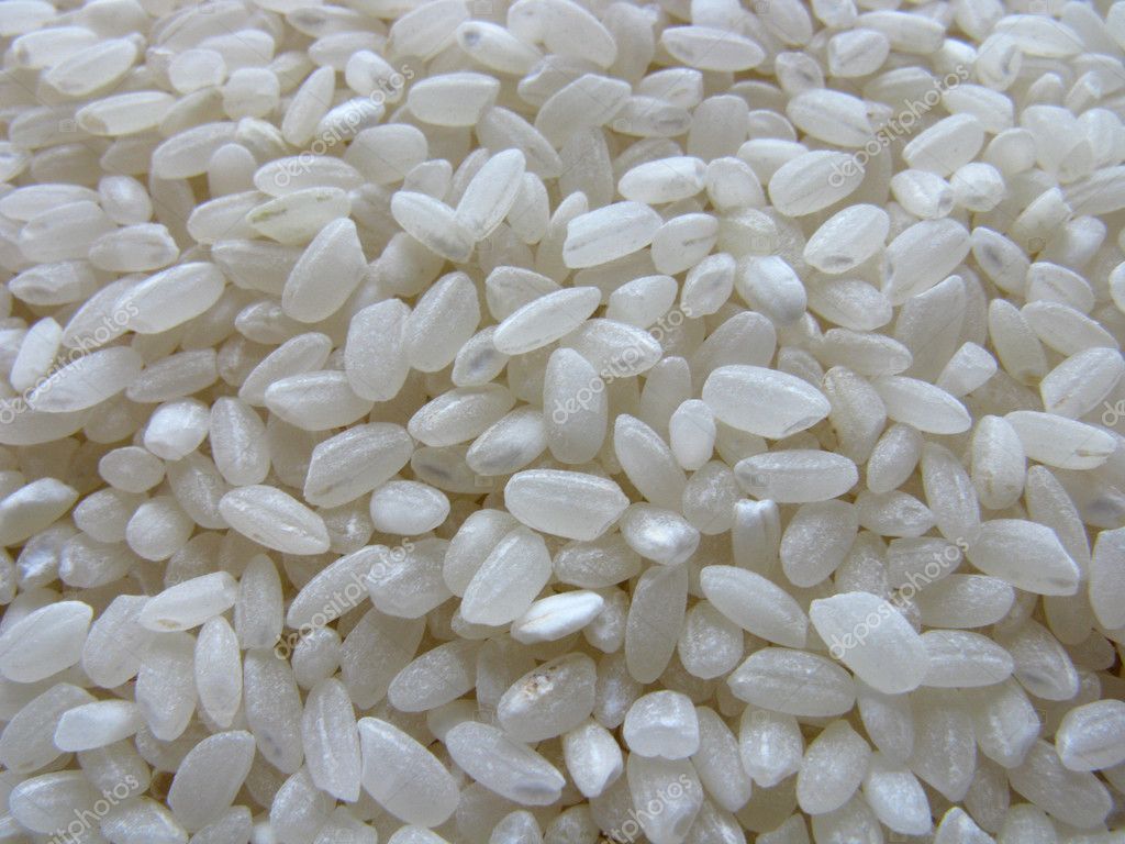 Background of rice. Rice background. — Stock Photo © Punctilious #126717552