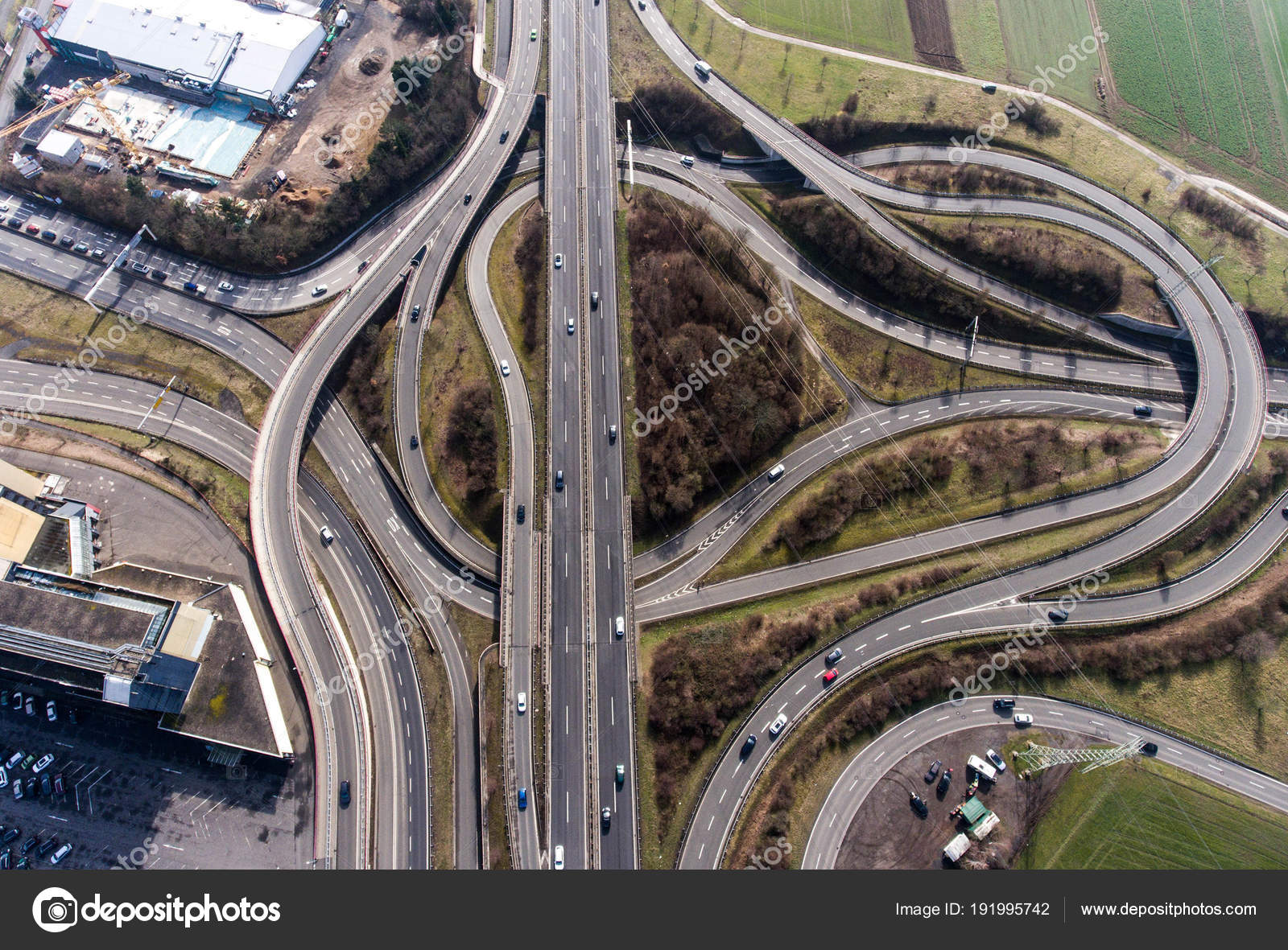 Aerial view of a highway intersection with a clover-leaf interchange ...