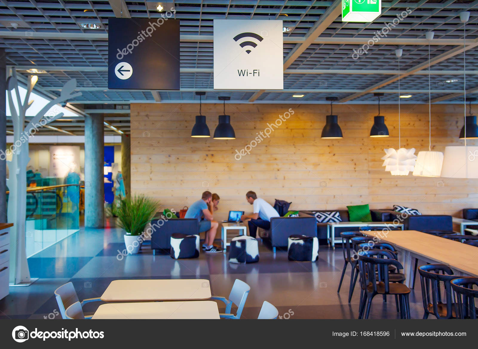 Wifi zone in modern cafe with blurred people on background. Wi-fi free ...
