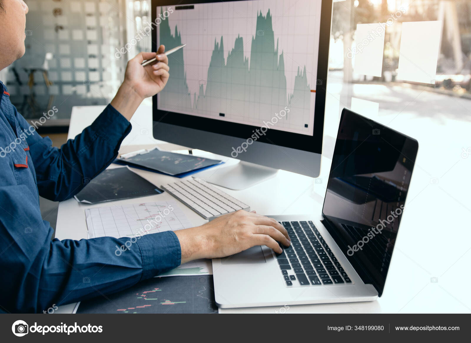 Investor Man Analyzing Graph Stock Market Using Pen Pointing Computer ...