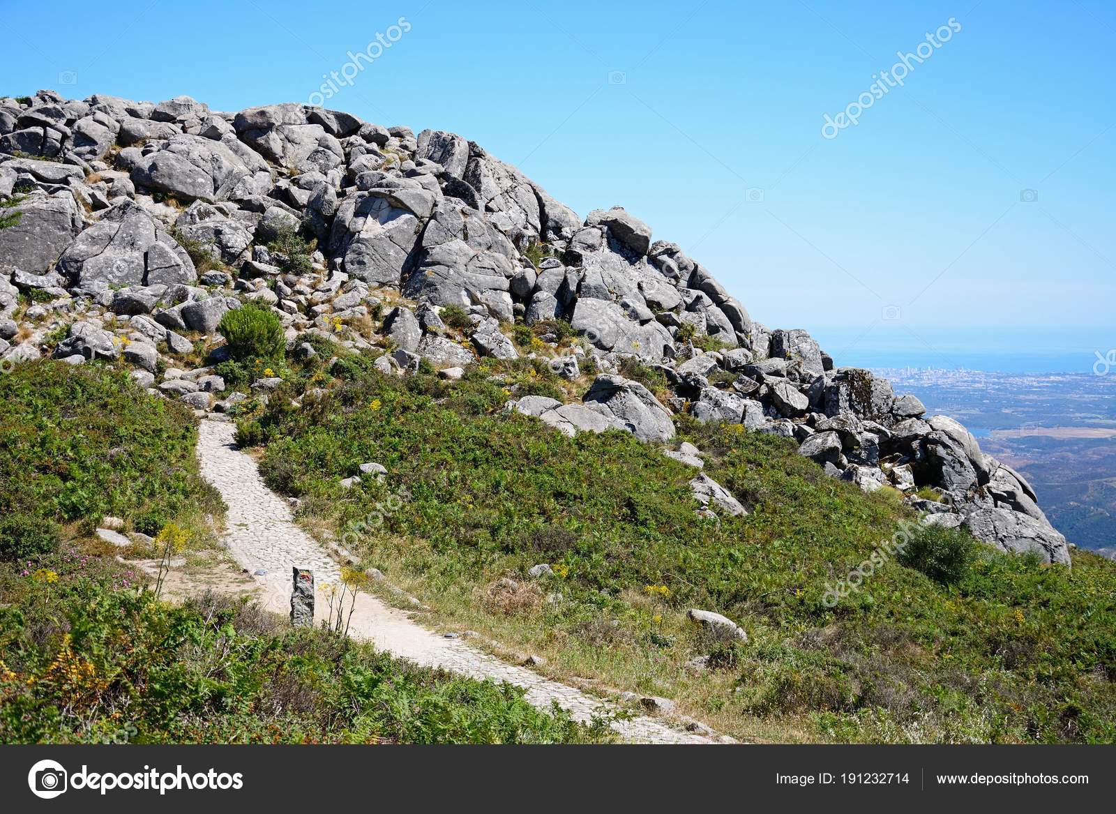 Mountain path leading to large rocks with across the Monchique ...