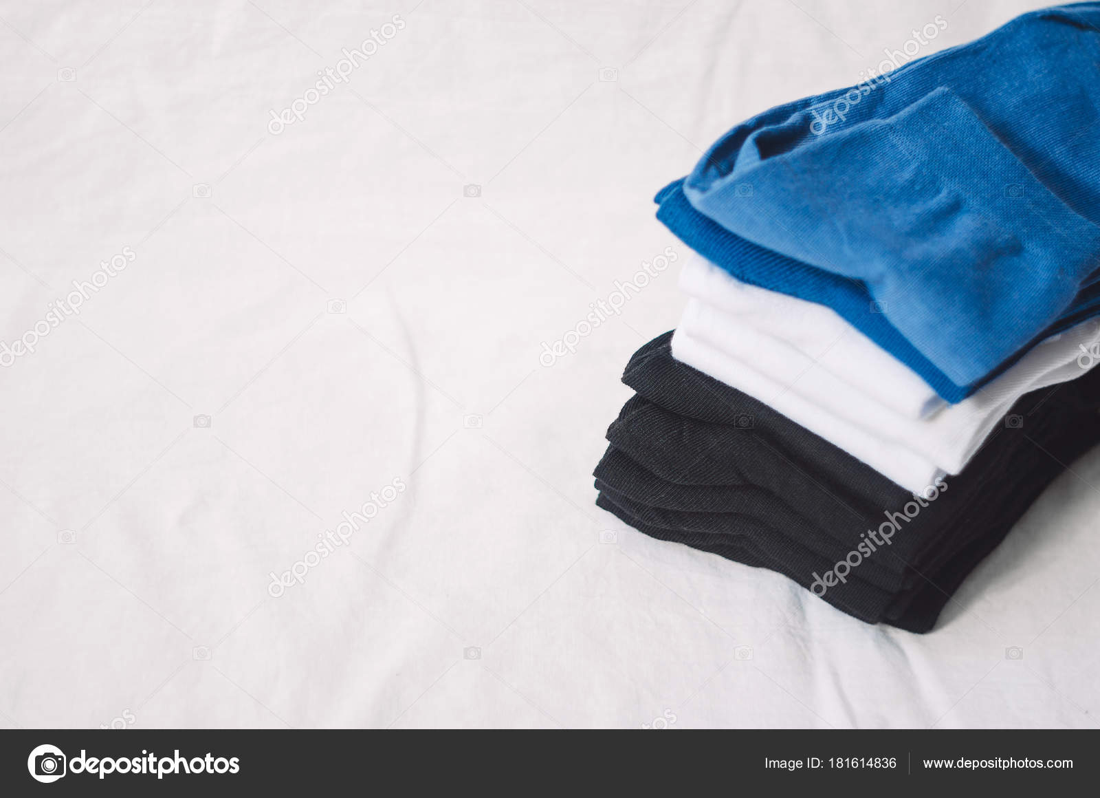 Stacked stack of socks. fabric on a white background — Stock Photo ...