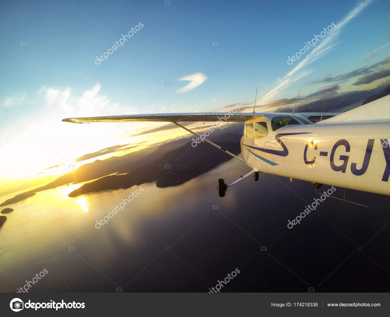 Cesna Flying In Sunset