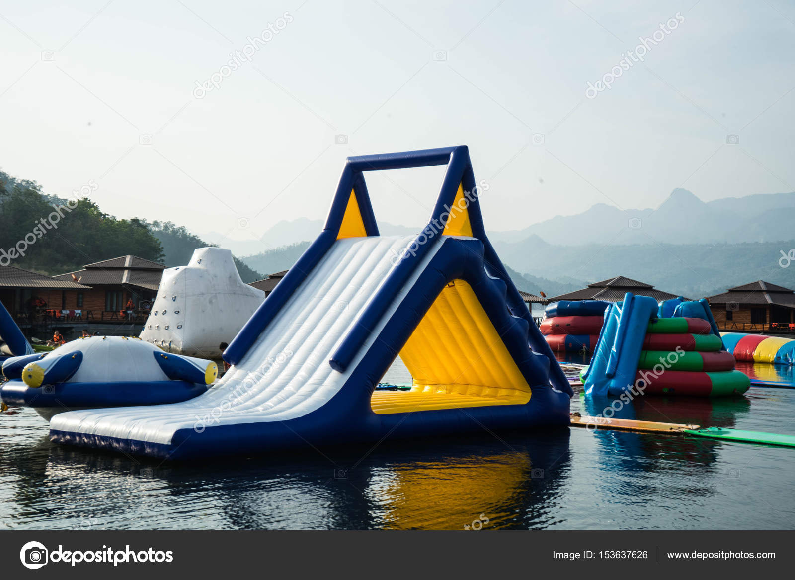 Blue inflatable floating water park Stock Photo by ©tumcruise 153637626