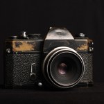 Old film camera with scratches and dust Stock Photo by ©FotoJagodka 2760678