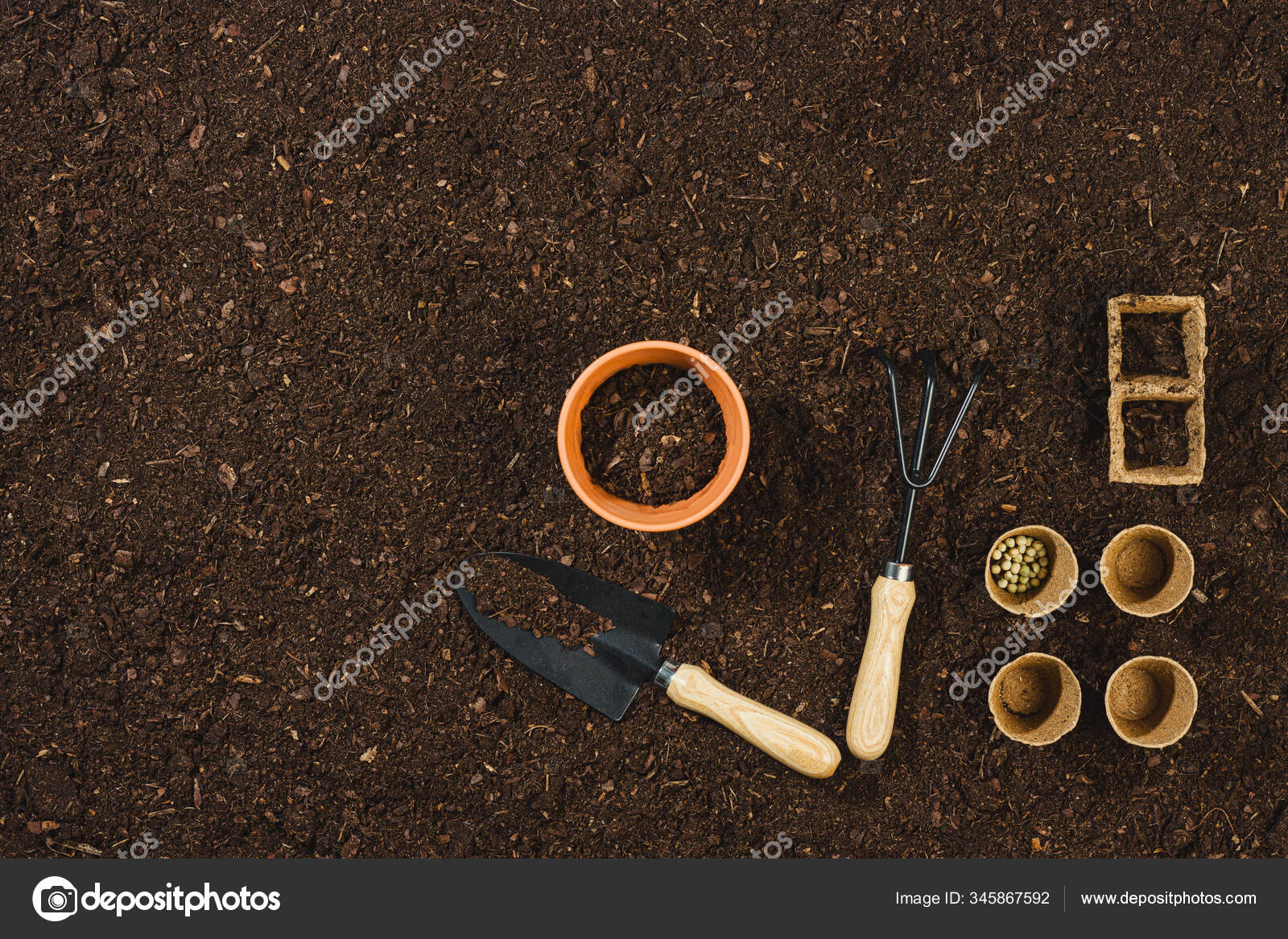 Gardening tools on soil texture background top view. Stock Photo by ...