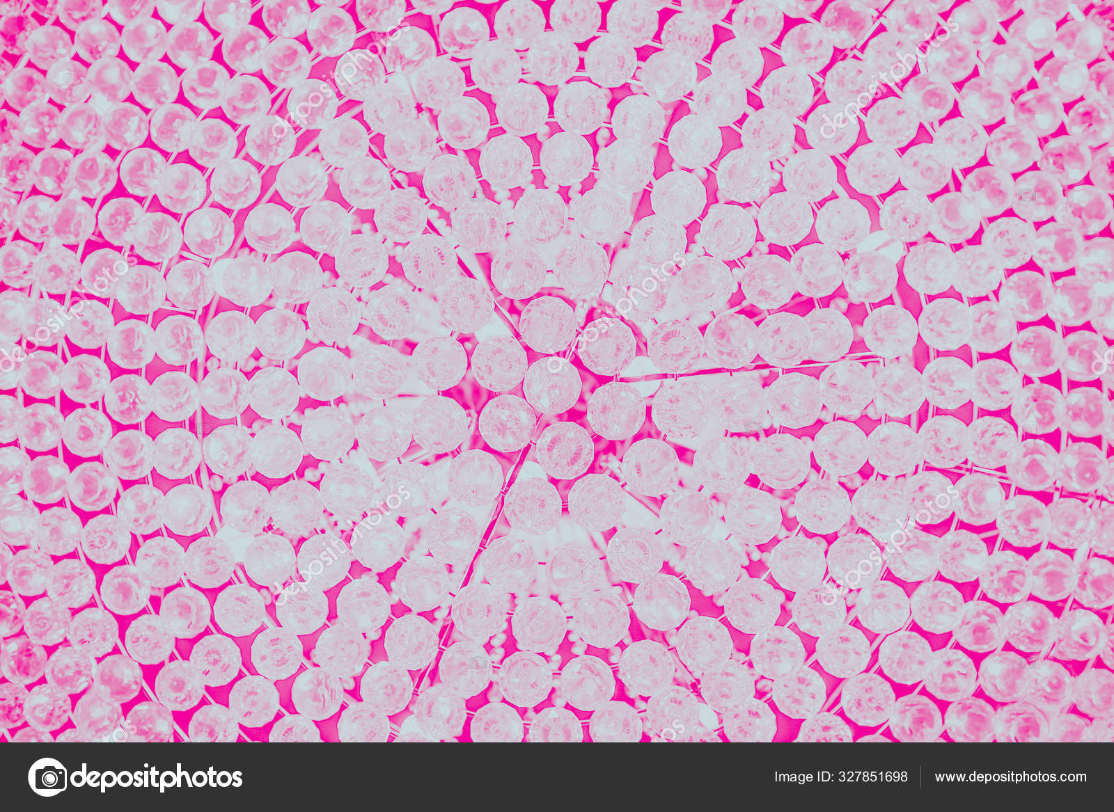 Pink gradient background. Cut-glass lamp, details. Fragment. Crystal ...