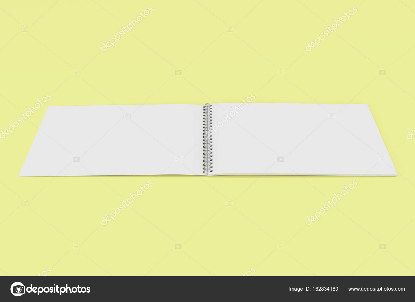 Open blank white notebook with metal spiral bound on yellow back ...