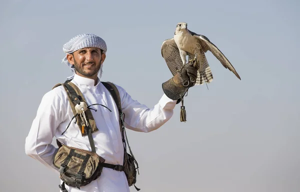 Falconer training Peregrine Falcon in desert – Stock Editorial Photo ...