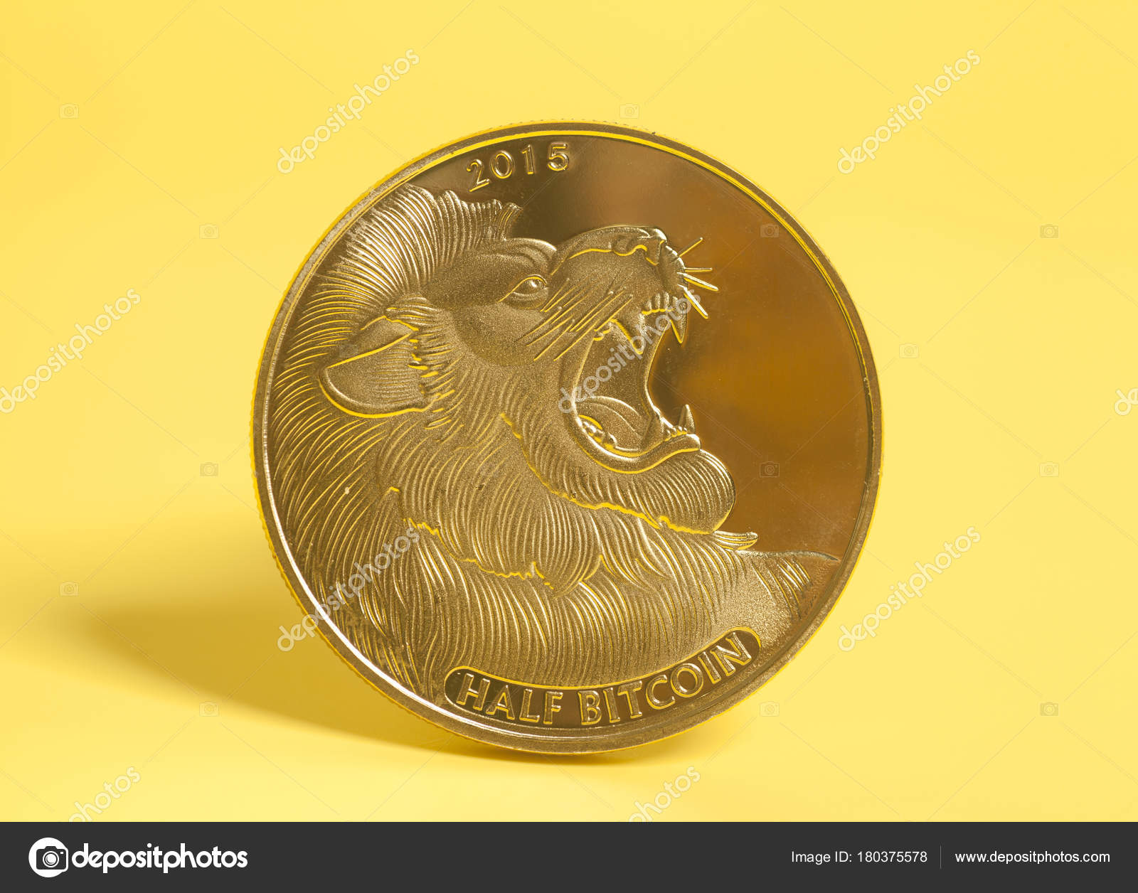 Half bitcoin with lion Stock Photo by ©yurchello_108 180375578