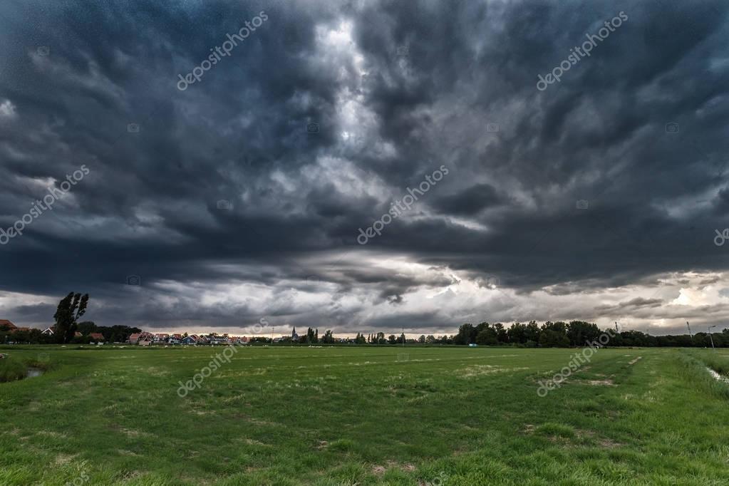 Stormy Weather with dramatic sky Stock Photo by ©MennoSchaefer 129039344