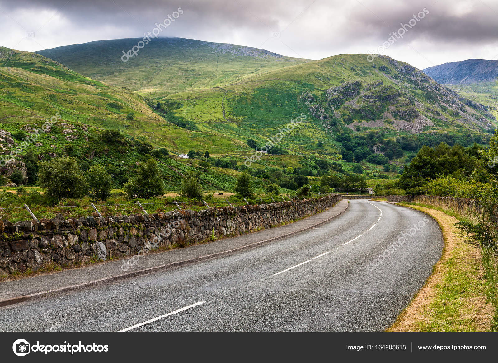 Curved road in Welsh countryside Stock Photo by ©mirovic 164985618