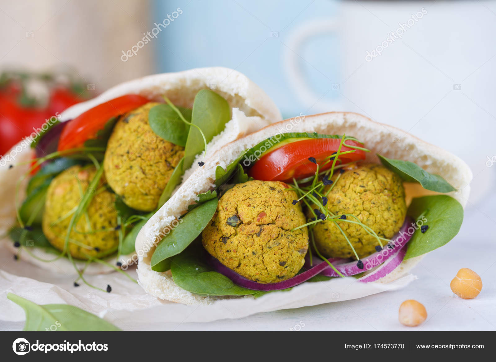 Baked falafel and fresh vegetables in pita bread, macro Stock Photo by ...
