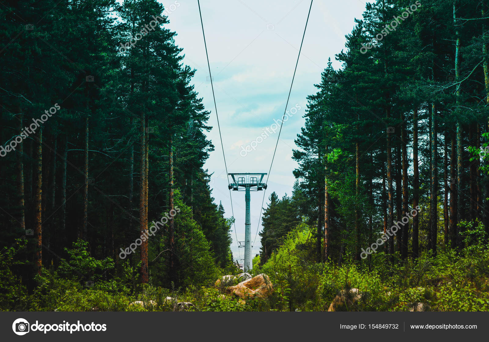 Steel cable way tower construction, blue sky on the background. Stock ...