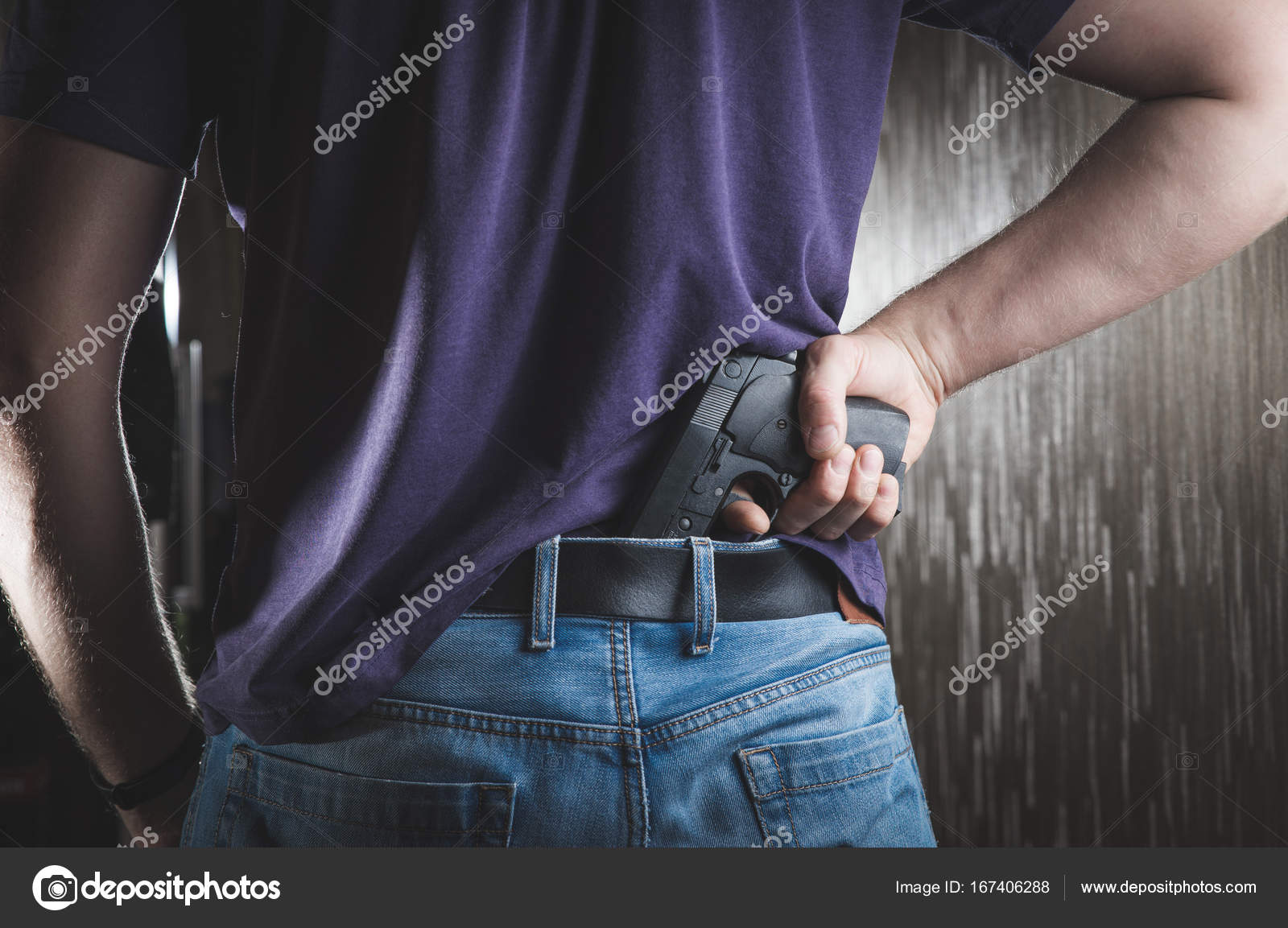 Black gun in the hand behind his back — Stock Photo © Konstantin1985 ...