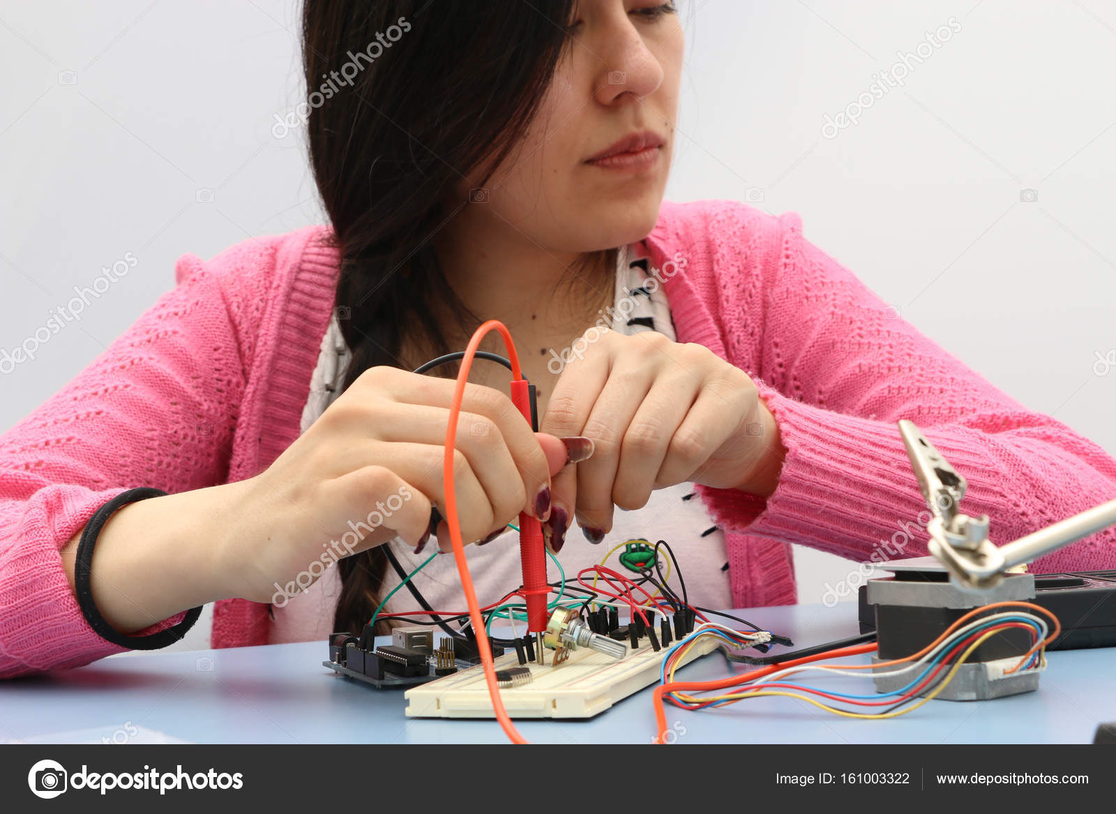 Technology student learning to prototype electronic circuits for ...