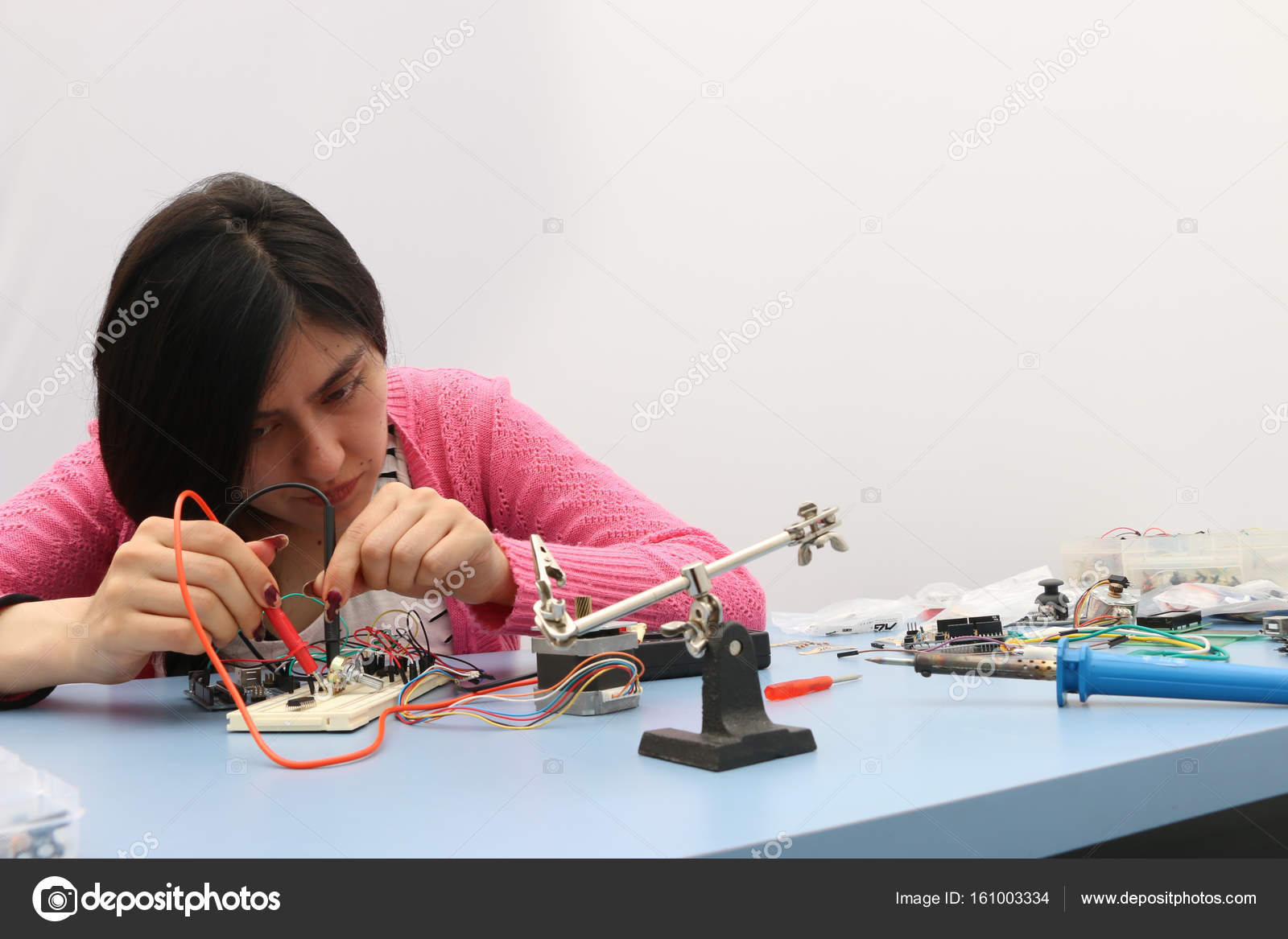 Technology student learning to prototype electronic circuits for ...