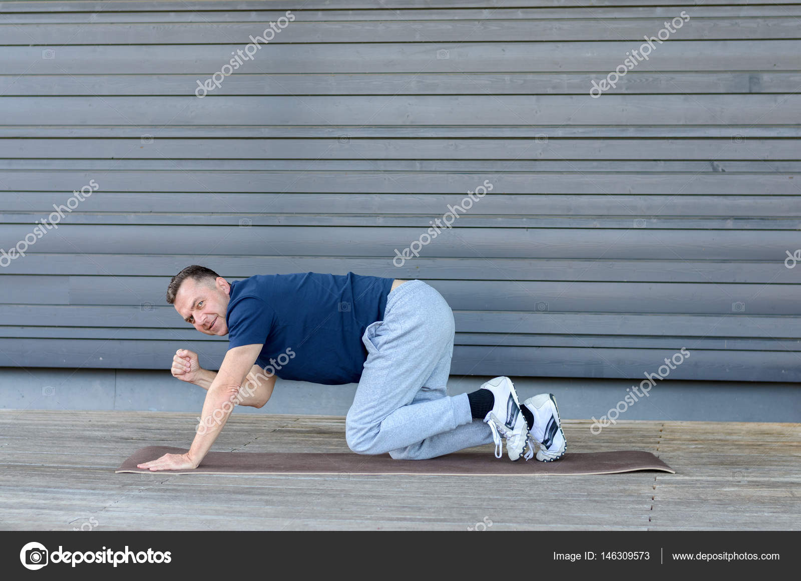 Man stretching in plank — Stock Photo © info.michaelheim-photographer ...