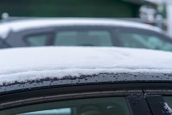 Layer of snow on the roof of a car - Stock Image - Everypixel