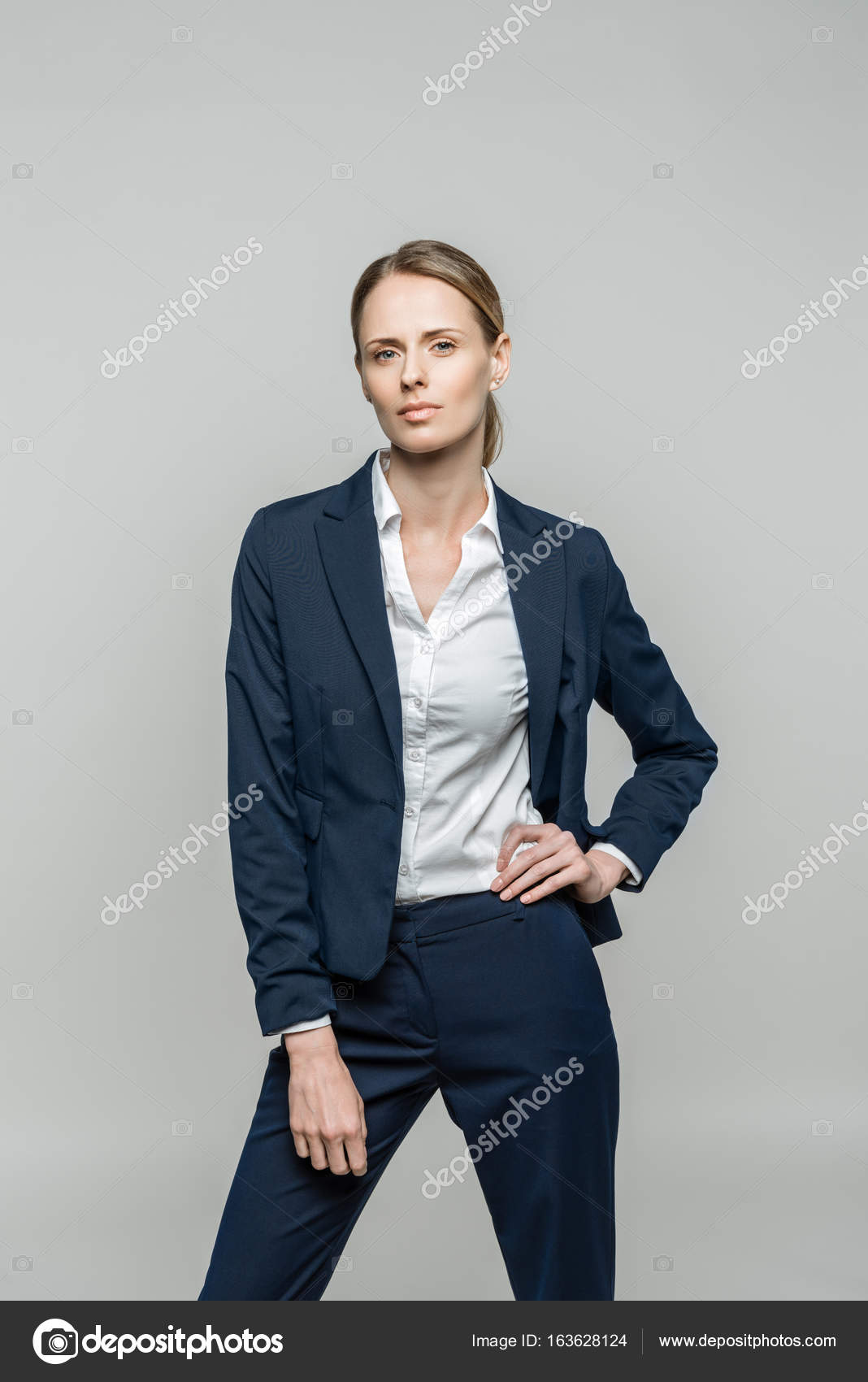 Attractive businesswoman in suit — Stock Photo © RomanPashkovsky #163628124 Attractive businesswoman in suit — Stock Photo © RomanPashkovsky #163628124