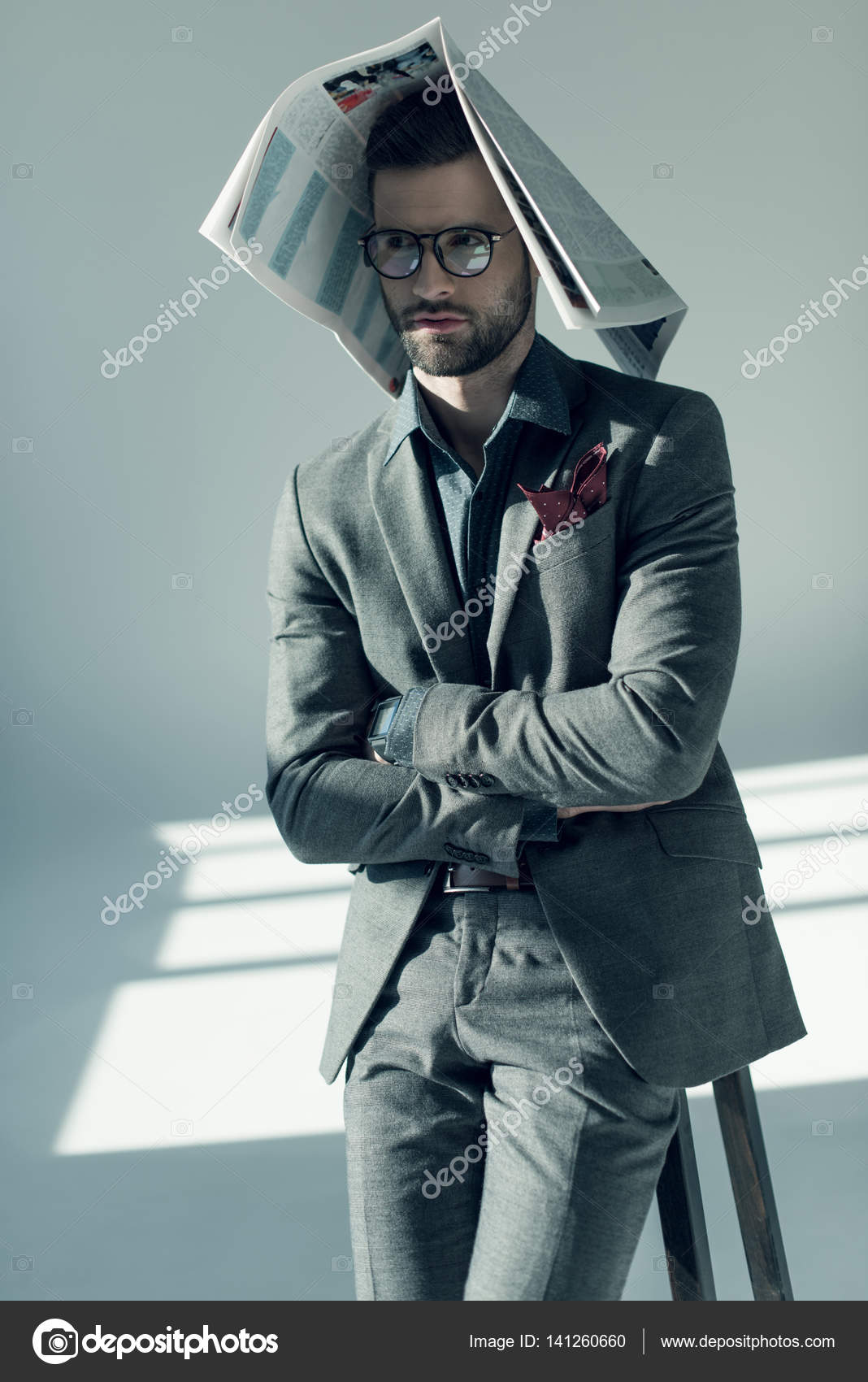 Handsome man with newspaper — Free Stock Photo © ArturVerkhovetskiy ...