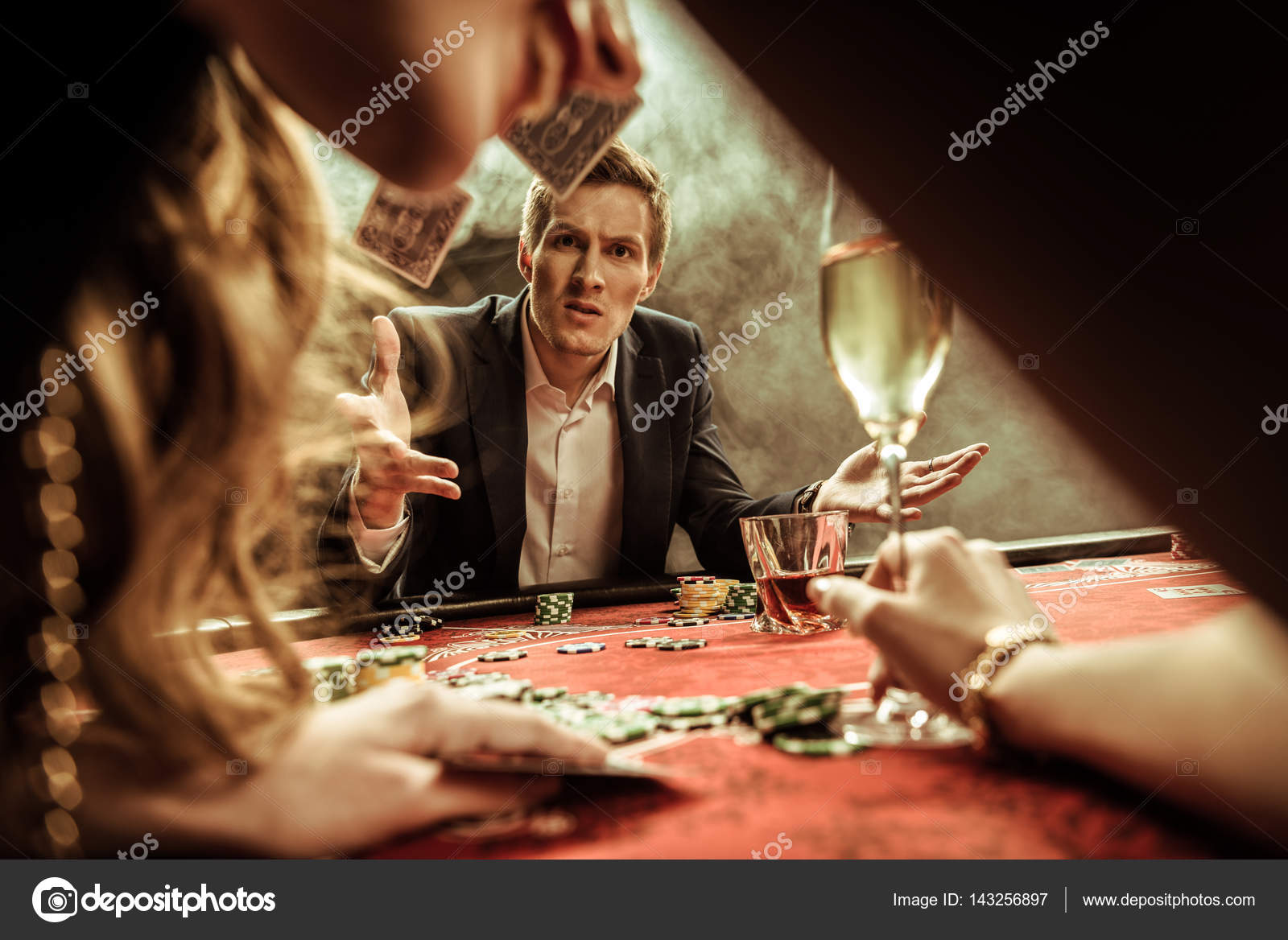 Man playing poker — Stock Photo © ArturVerkhovetskiy #143256897