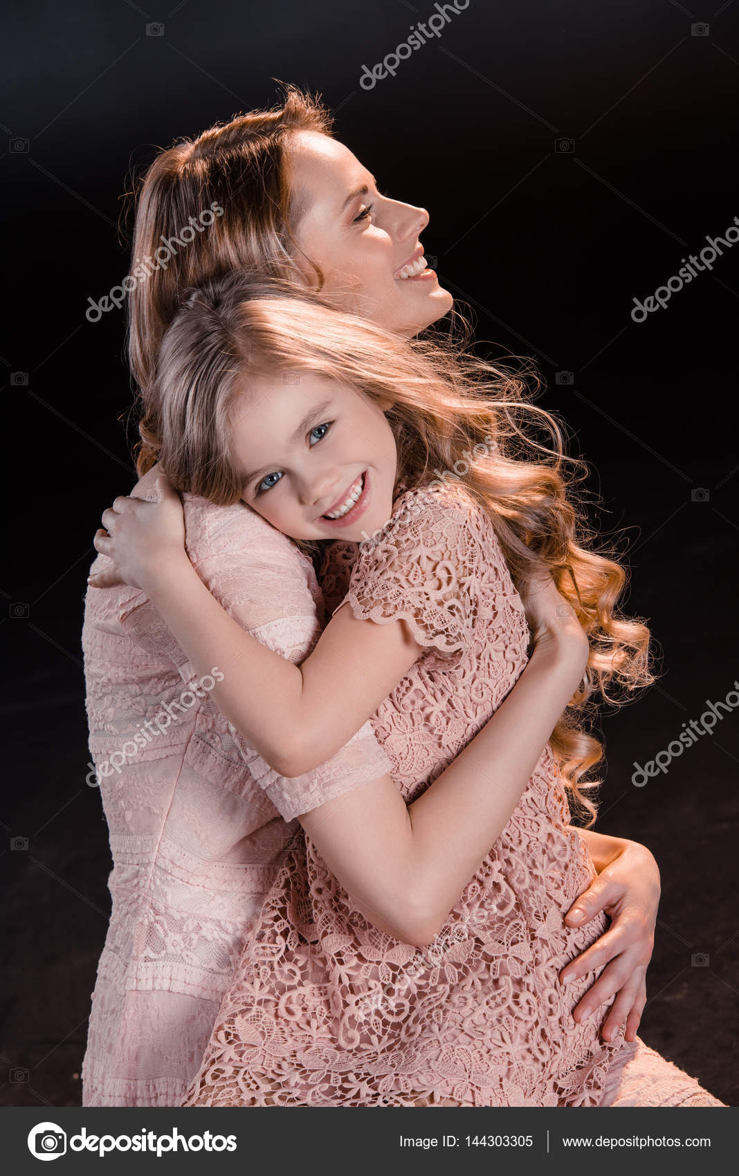 Beautiful mother and daughter — Stock Photo © ArturVerkhovetskiy #144303305 Beautiful mother and daughter — Stock Photo © ArturVerkhovetskiy #144303305
