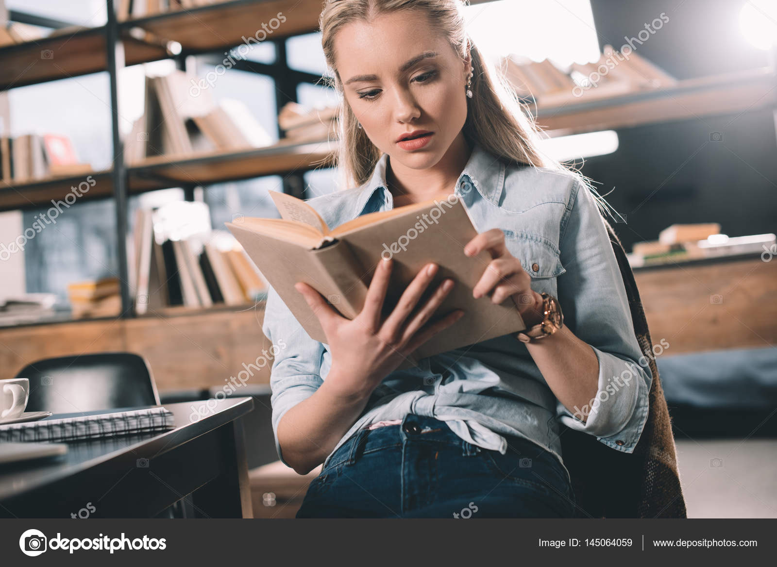 Student reading book — Stock Photo © ArturVerkhovetskiy #145064059