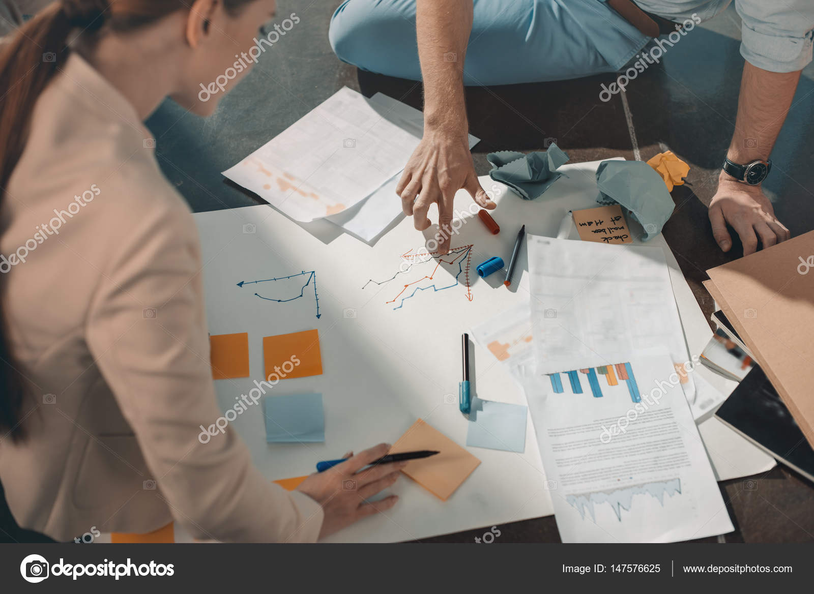 Business people working with graphs — Stock Photo © ArturVerkhovetskiy ...