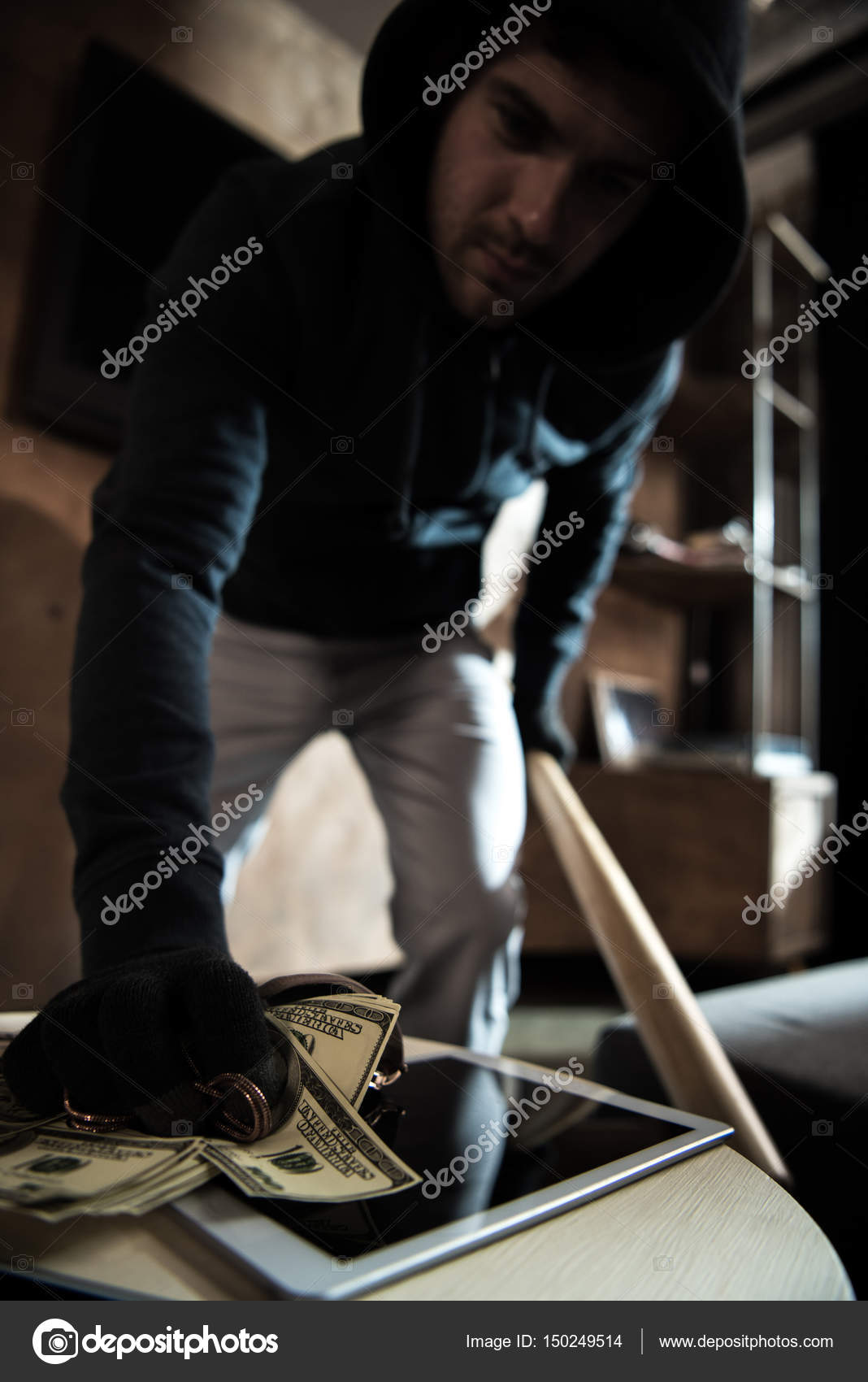 Robber stealing money — Stock Photo © ArturVerkhovetskiy #150249514
