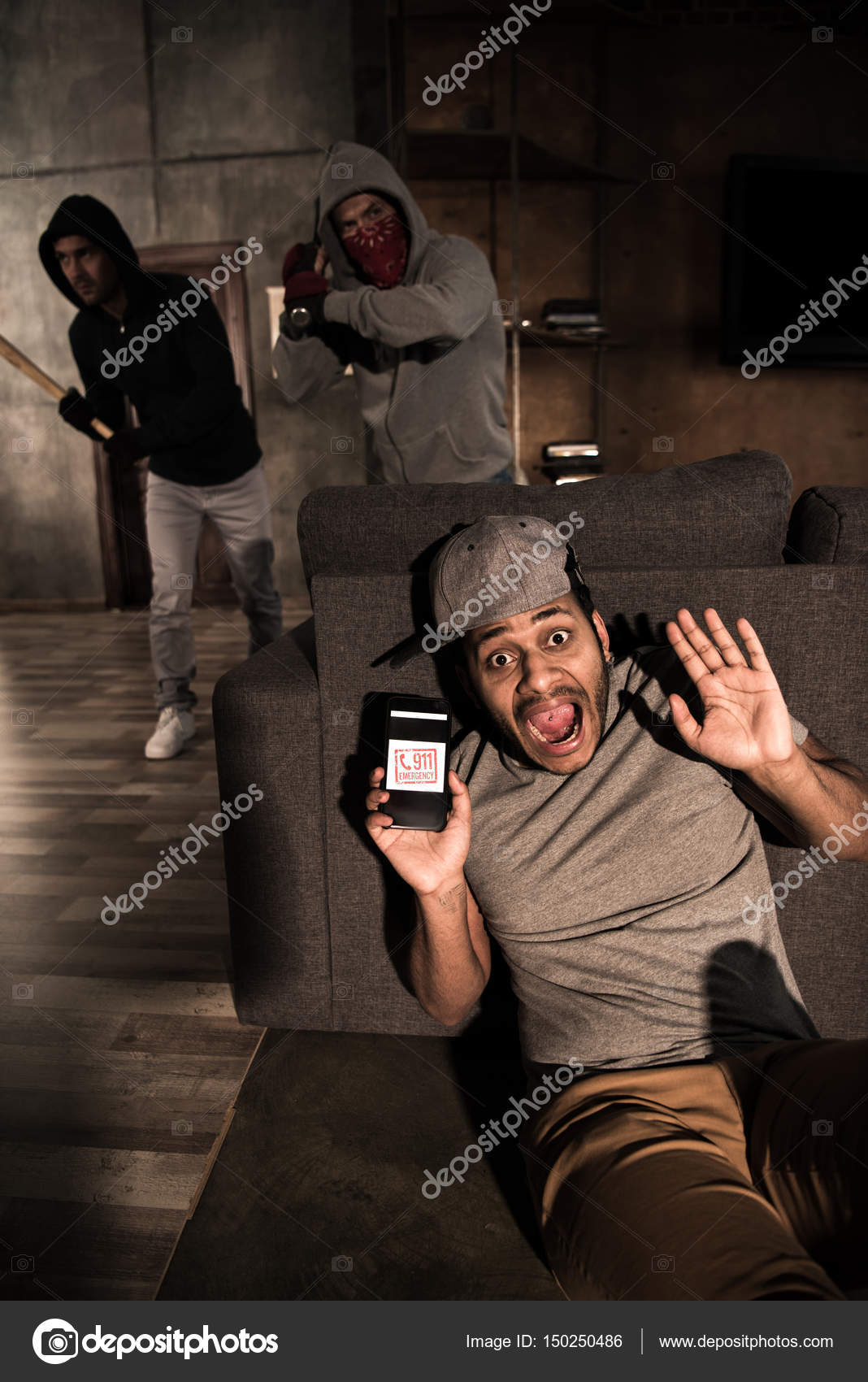 Burglars and scared man — Stock Photo © ArturVerkhovetskiy #150250486