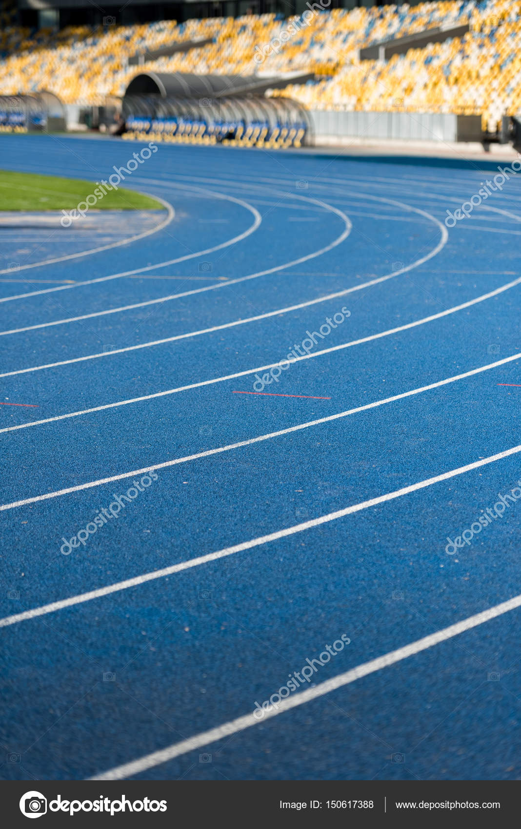 Blue running track Stock Photo by ©ArturVerkhovetskiy 150617388