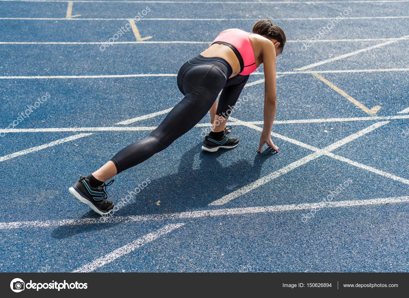Sportswoman on starting line — Stock Photo © ArturVerkhovetskiy #150626894