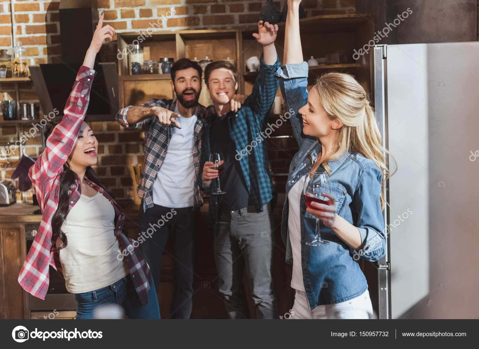 Young people partying Stock Photo by ©ArturVerkhovetskiy 150957732